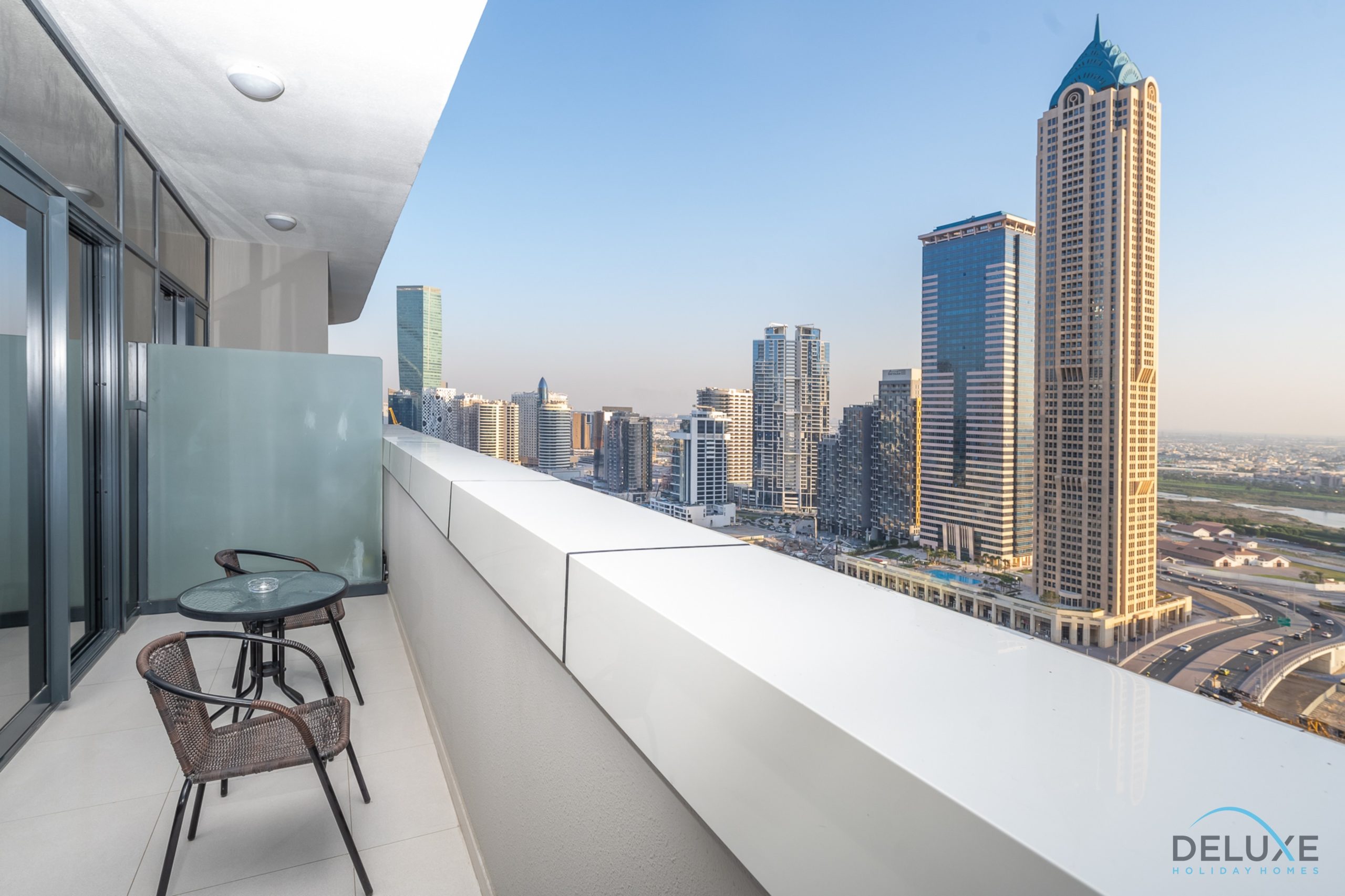 Homely 1BR at DAMAC Zada Tower - Deluxe Holiday Homes™